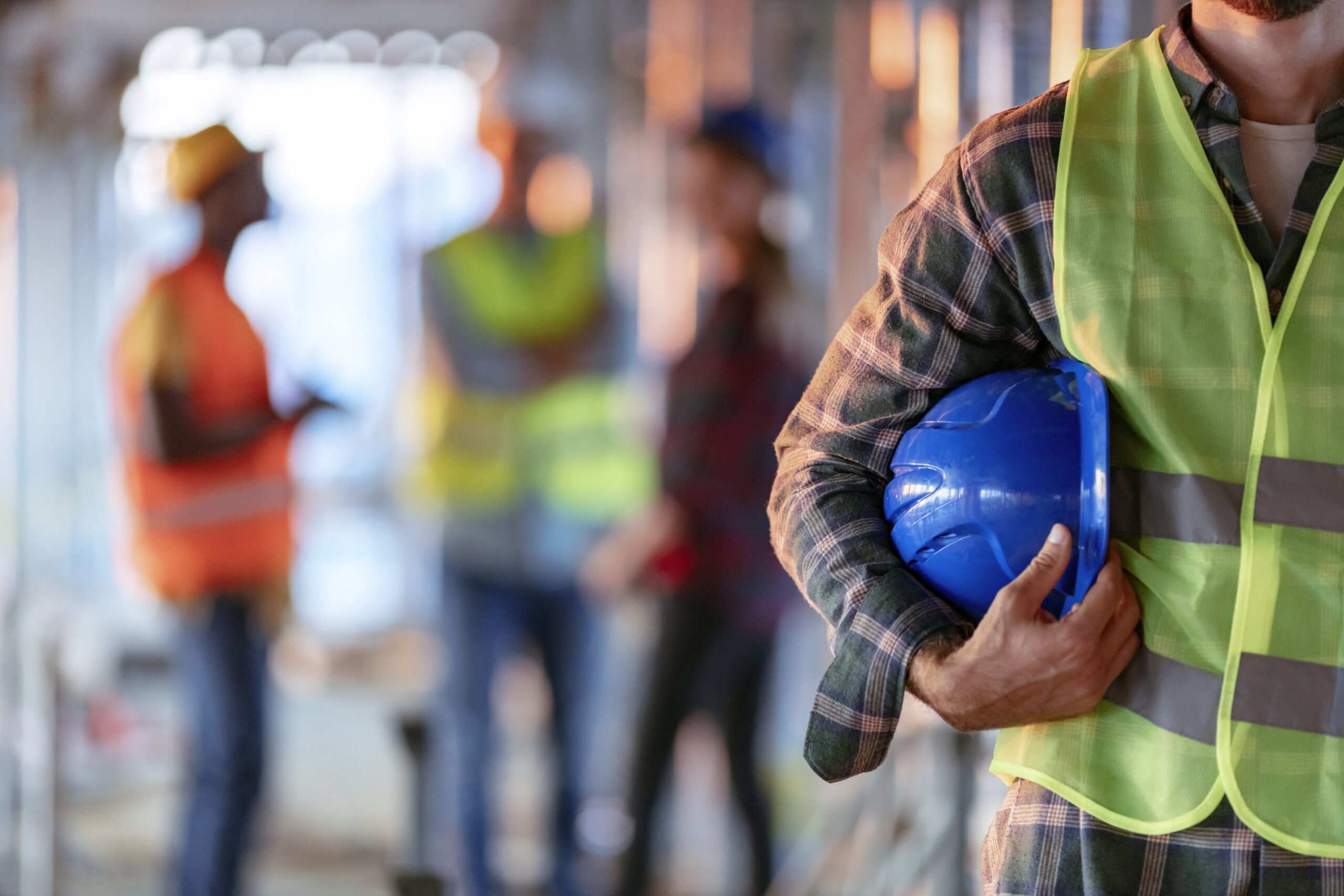 Man holding blue helmet close up - Made Safe